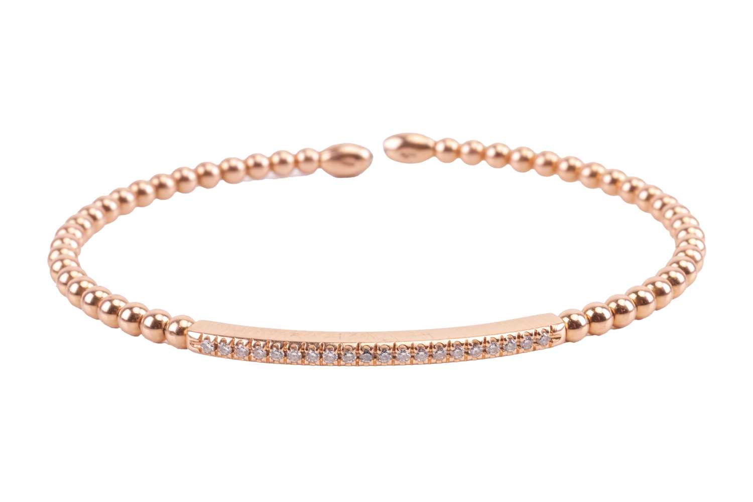 Lot 90 - A diamond-set torque bangle, comprising of an