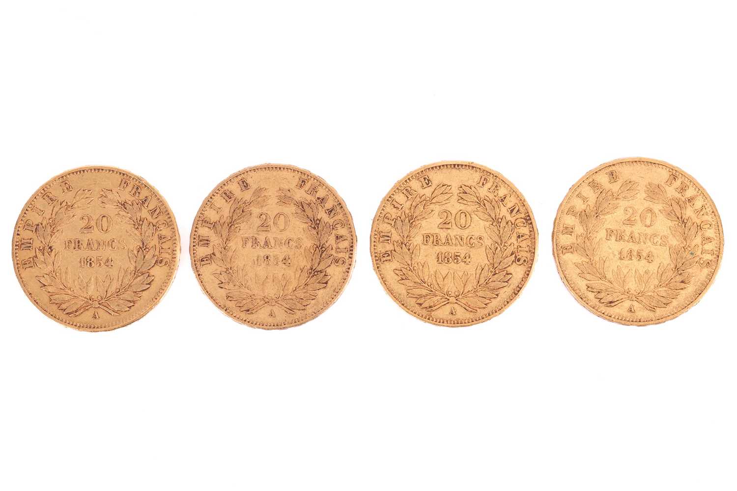 Lot 58 - Four Napoleon III 20 franc coins, all dated