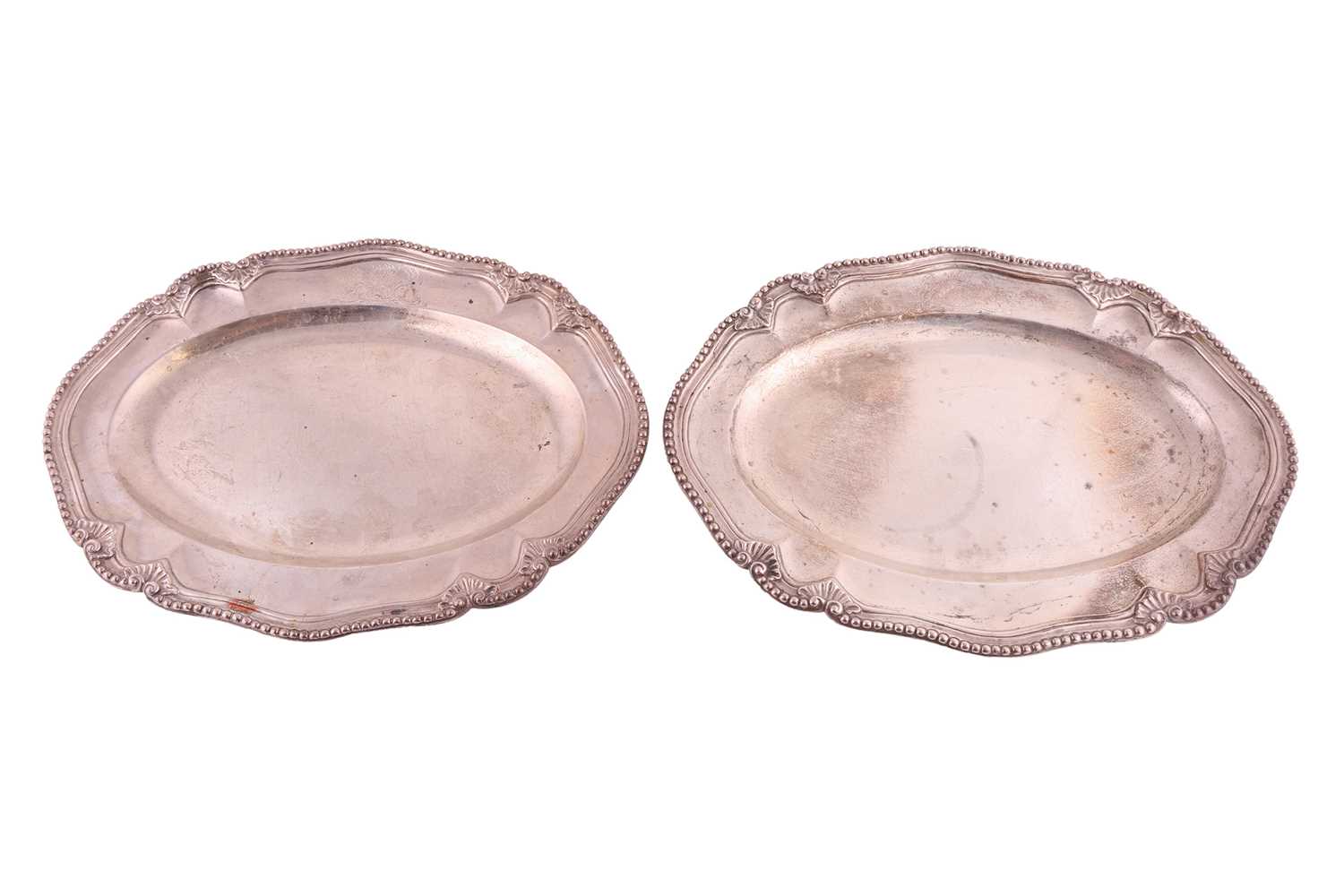 Lot 238 - A pair of George III silver serving platters