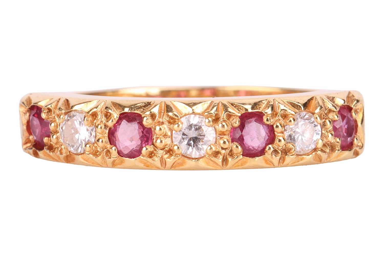 Lot 110 - A ruby and diamond half hoop ring set in