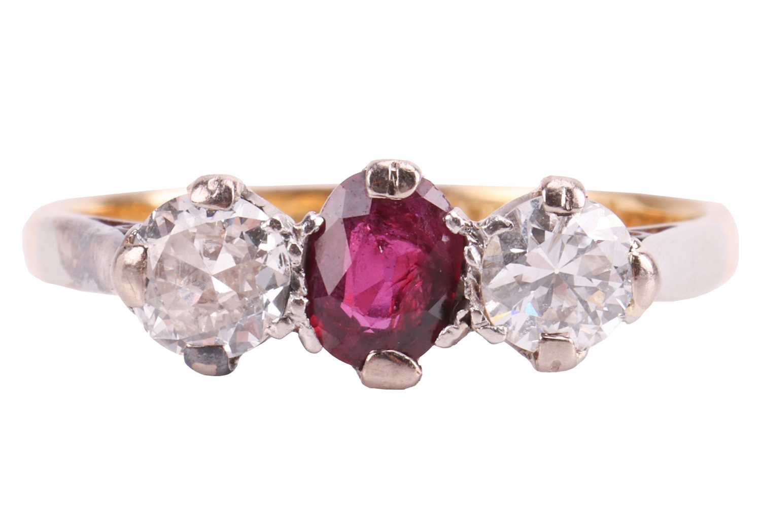 Lot 180 - A ruby and diamond trilogy ring, centred