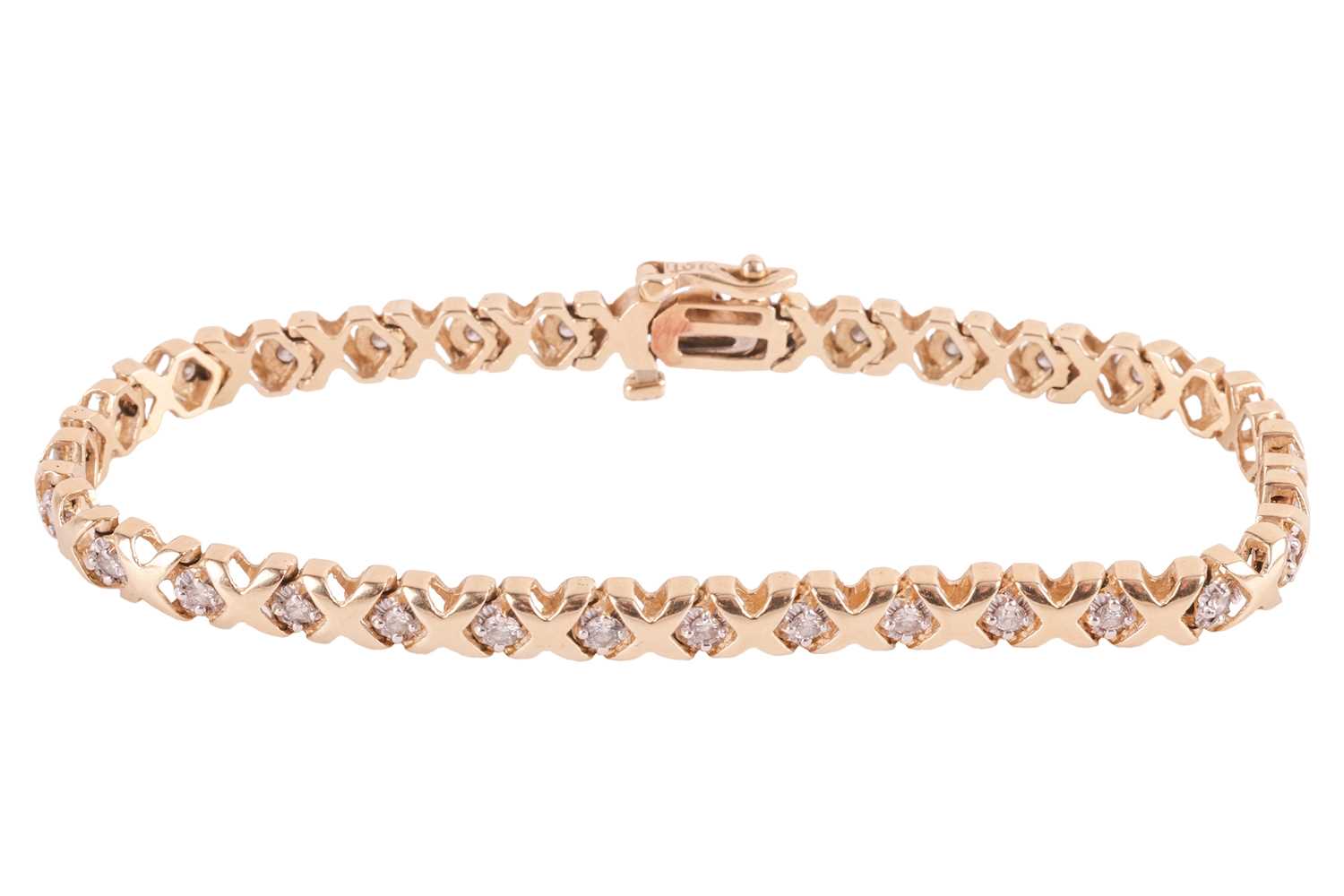 Lot 41 - A diamond-set line bracelet, with an