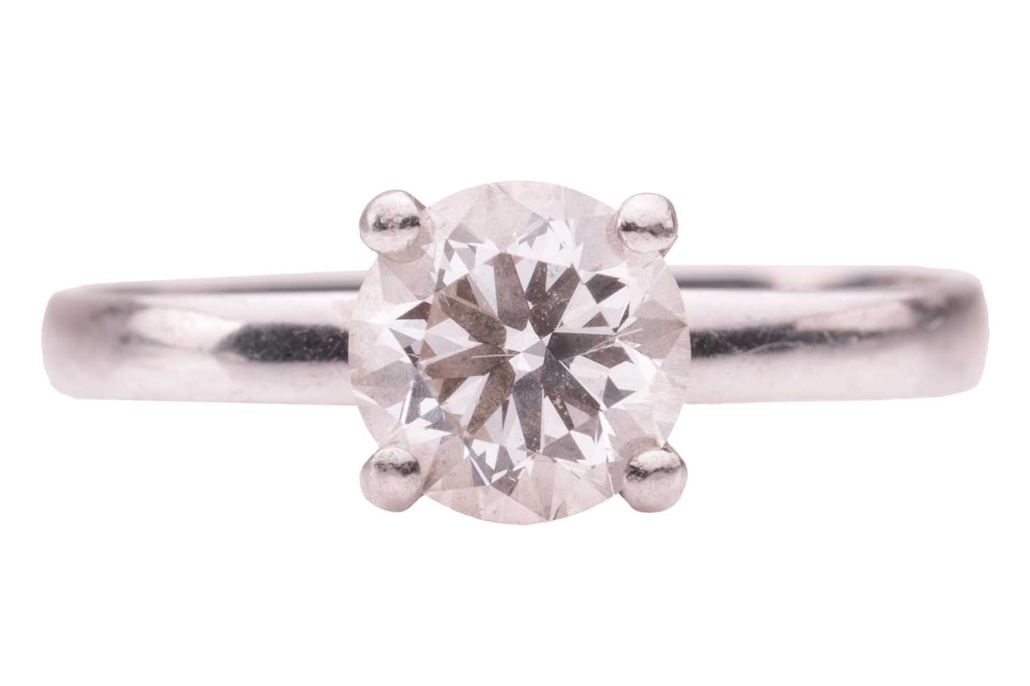 A solitaire diamond ring, claw-set with a round