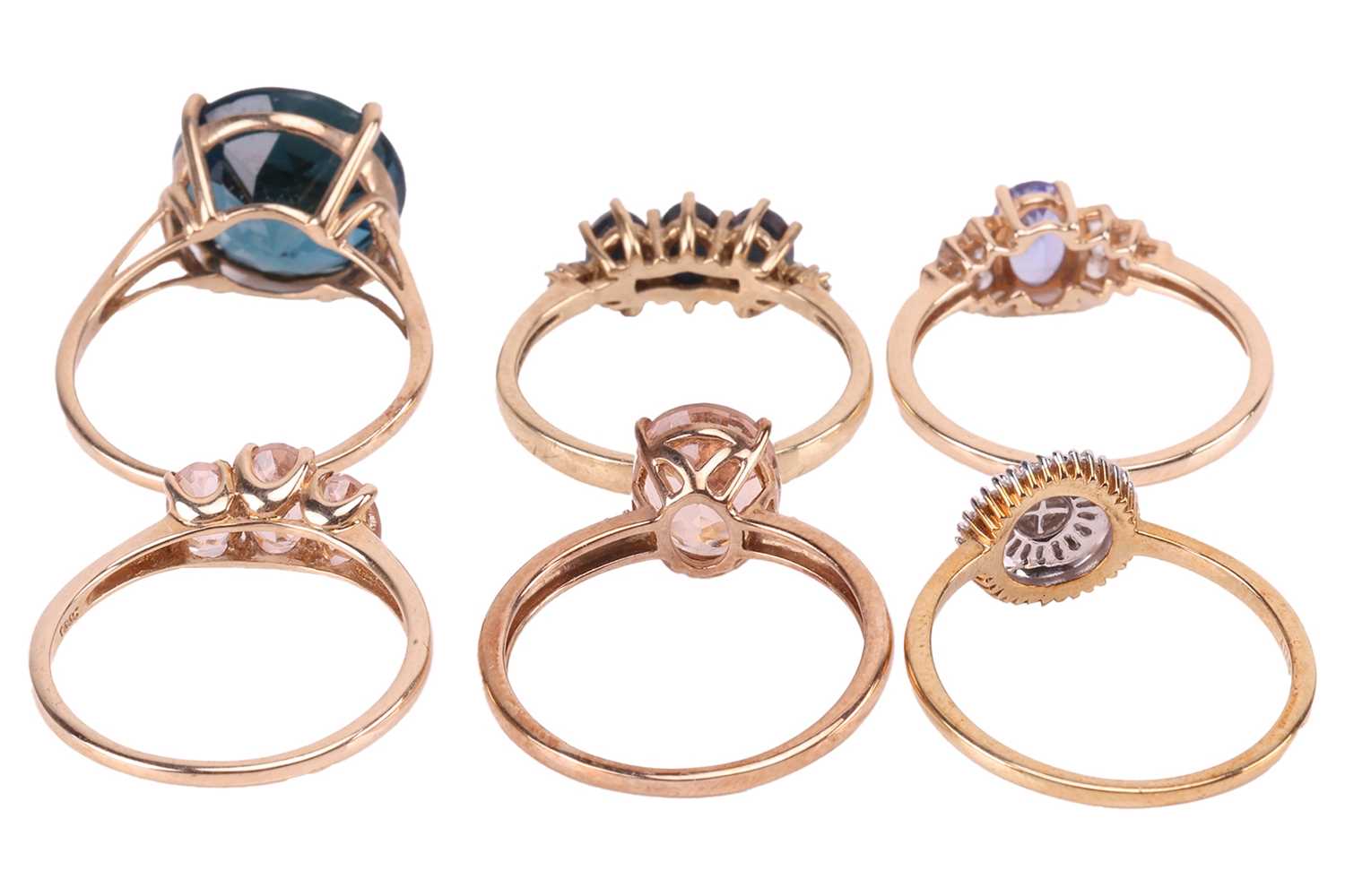 Lot 45 - A collection of six gem-set rings in 9ct gold;