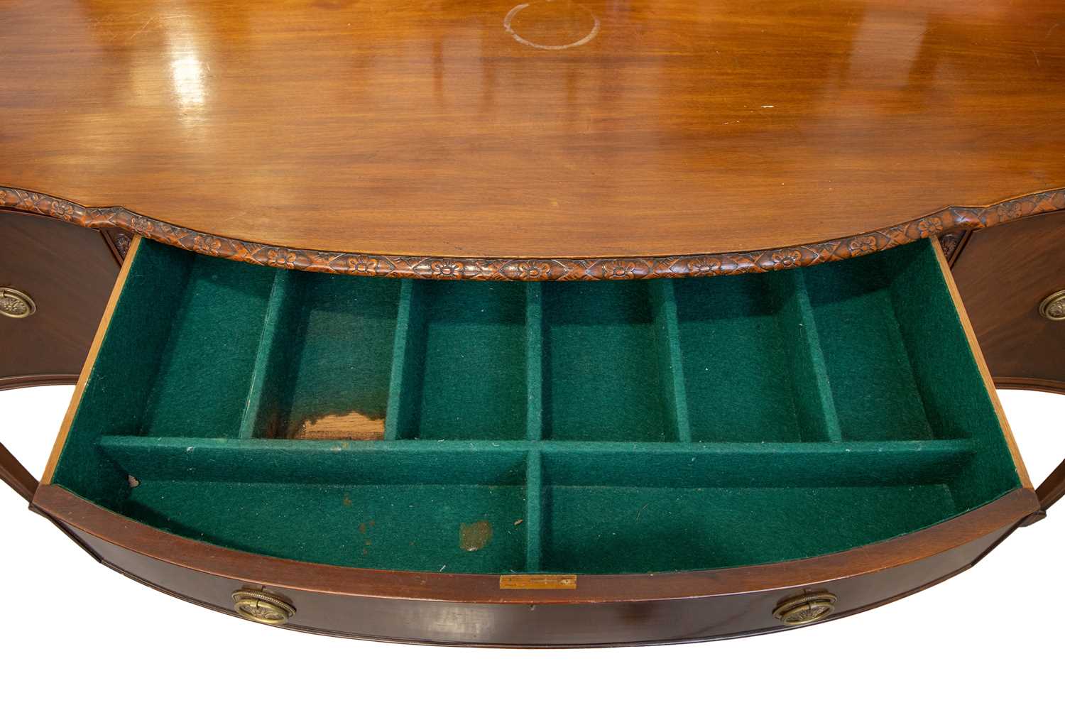 Lot 95 - A mahogany large serpentine sideboard of