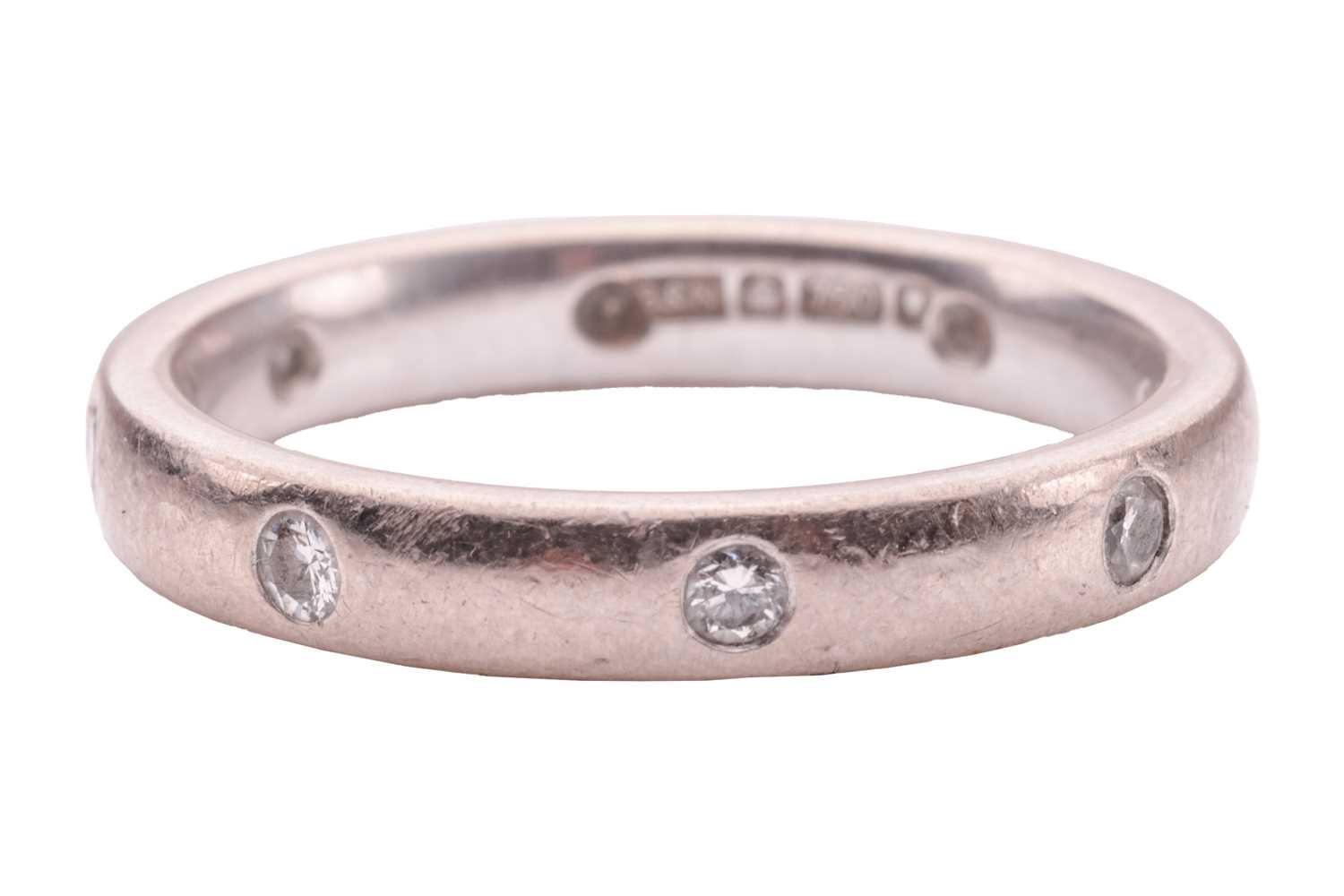 Lot 17 - An 18ct white gold diamond-set band ring,