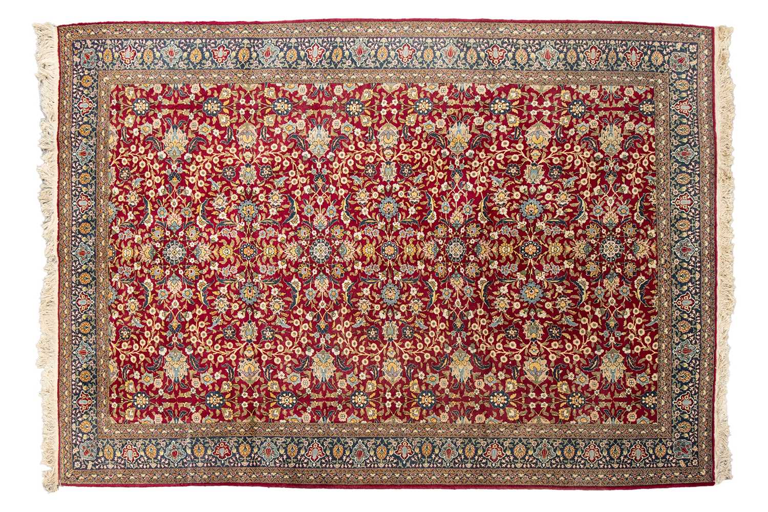 Lot 116 - An Indian handknotted rimson ground carpet,