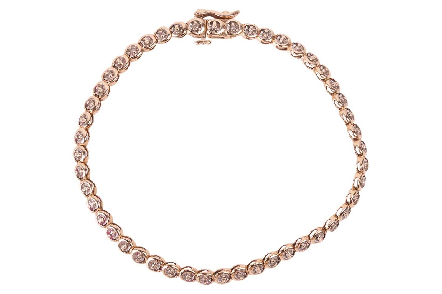 Lot 203 - A diamond-set line bracelet; featuring