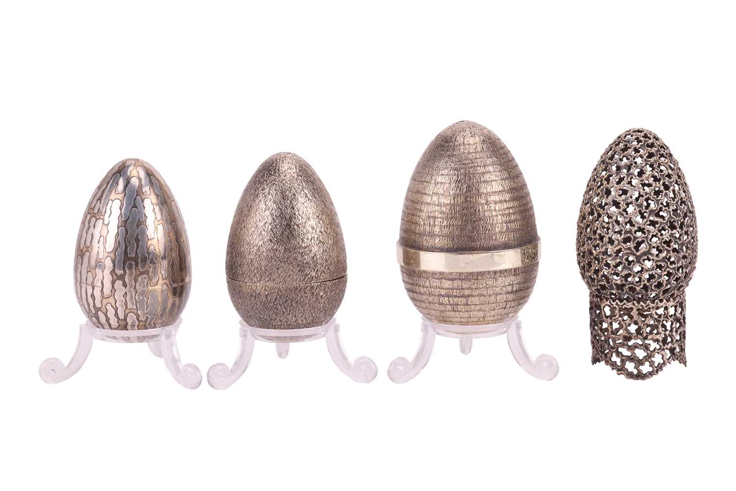 Lot 317 - Stuart Devlin: four silver eggs of varying