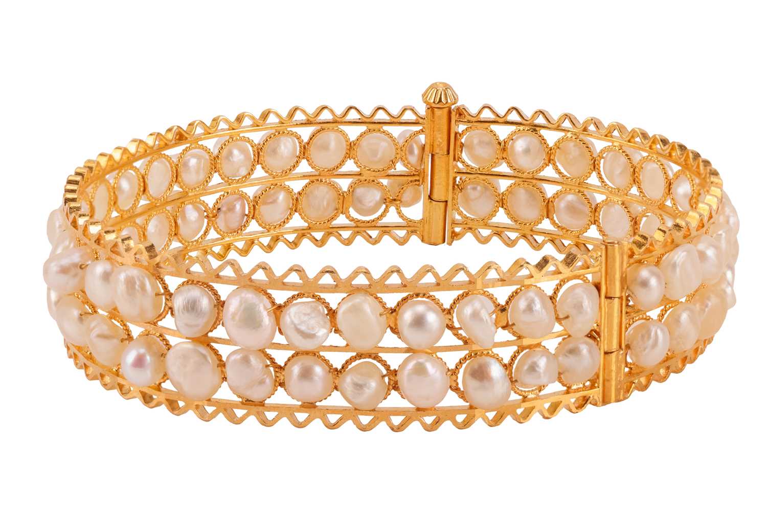 Lot 227 - A pearl set openwork bangle; of hinged oval