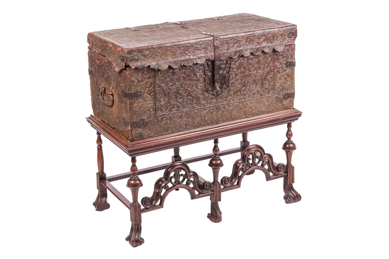 Lot 35 - An embossed leather trunk on rosewood stand,